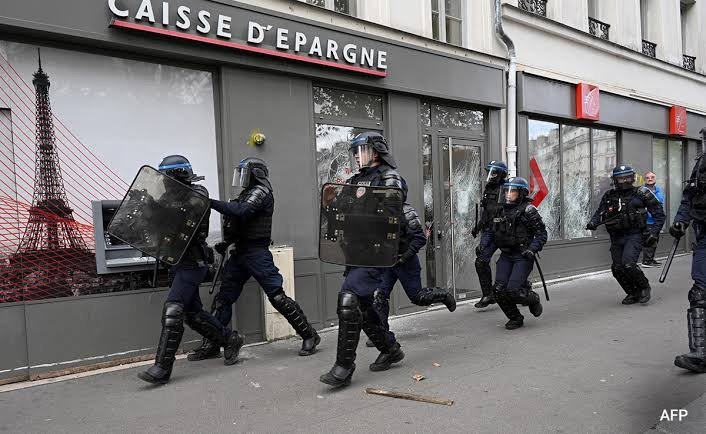 Violent cashes erupt in Paris protest as police vehicle comes under ...